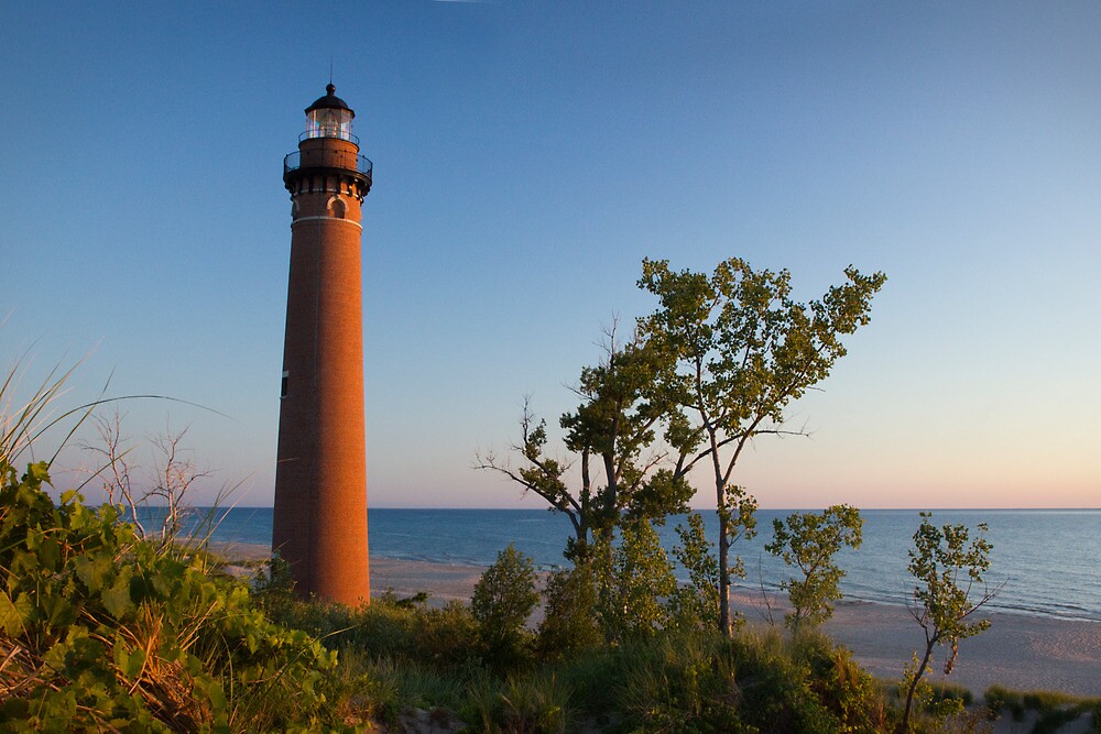 "Little Sable Lighthouse by the shore near Silver Lake Michigan" by ...