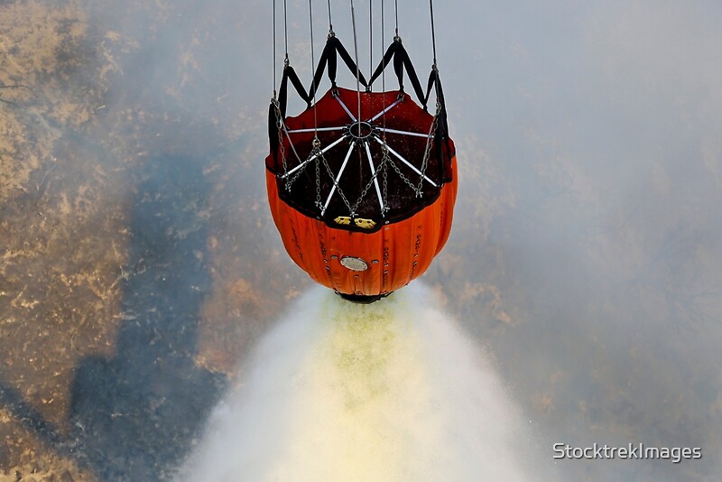 "Water drops are performed using Bambi Buckets to assist the wildfires ...